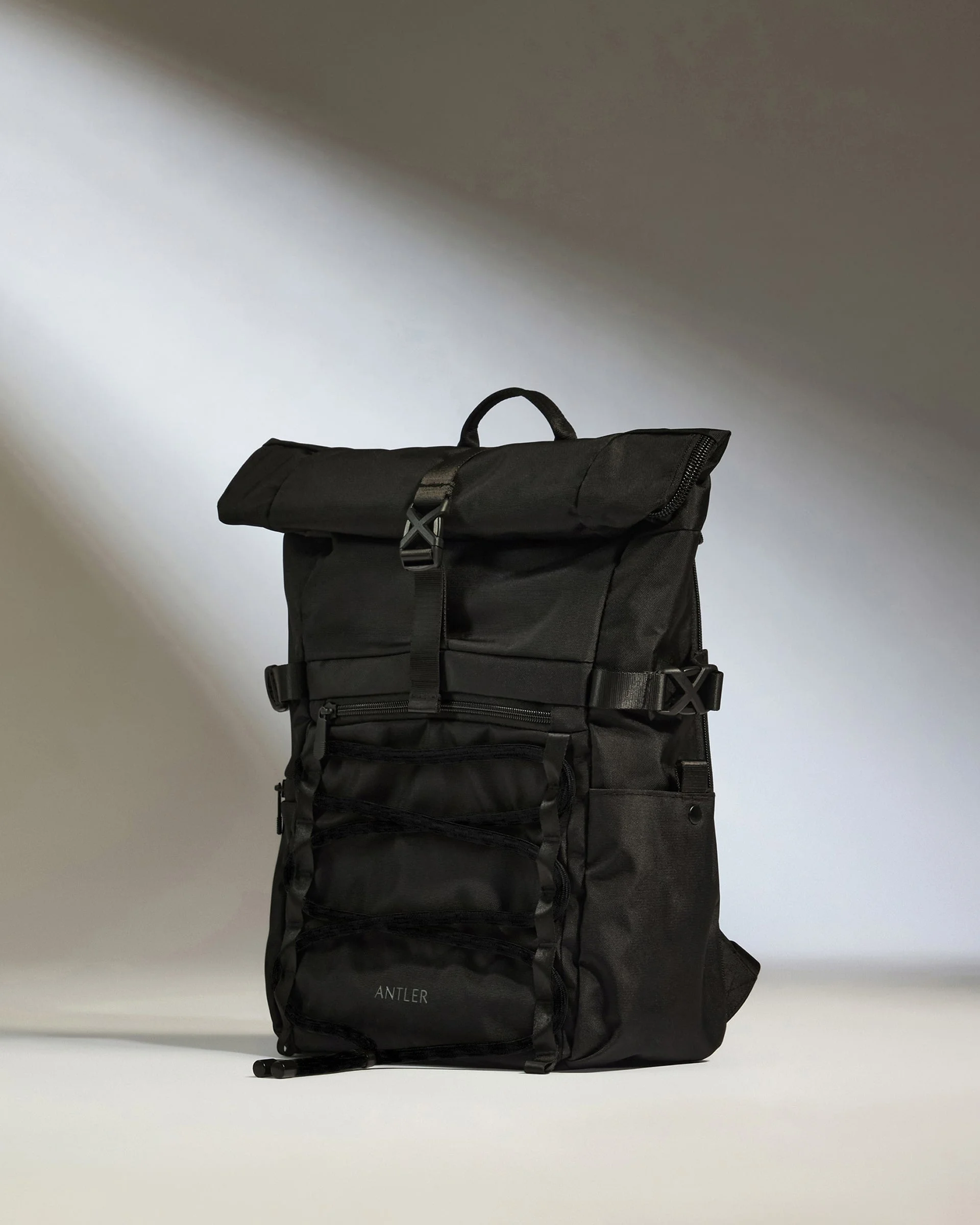 Discovery Roll Top Backpack in Black - Borderfree